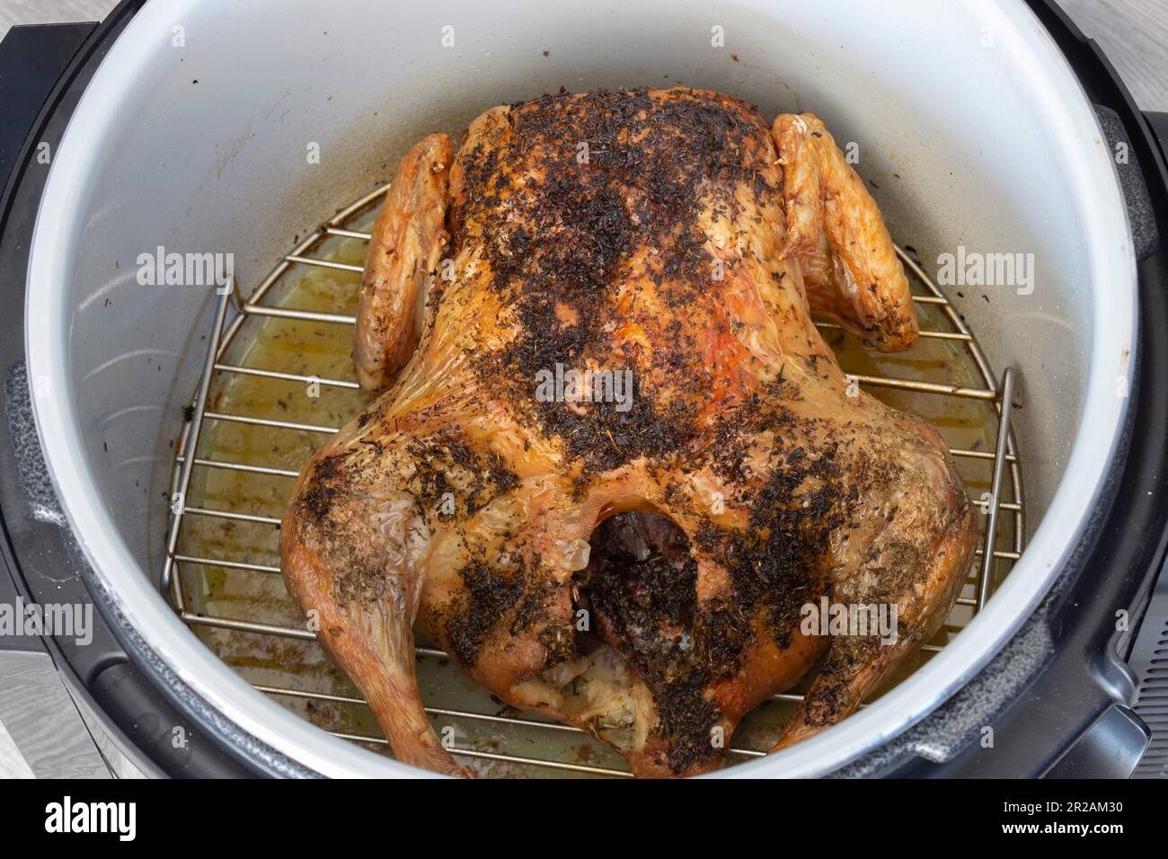 Chicken covered with mixed herbs cooked in an air fryer. Healthy low ...