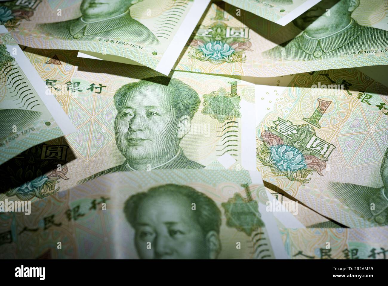 Closeup of a group of one yuan banknotes with the portrait of Mao Tse ...