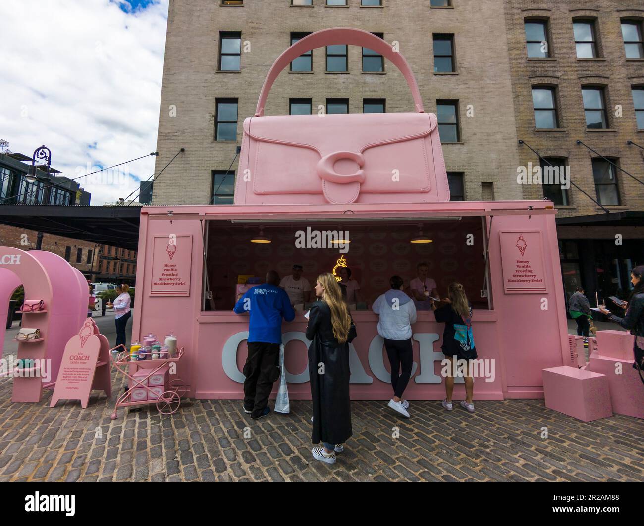 Visitors participate in the Coach brand activation in Gansevoort Plaza ...