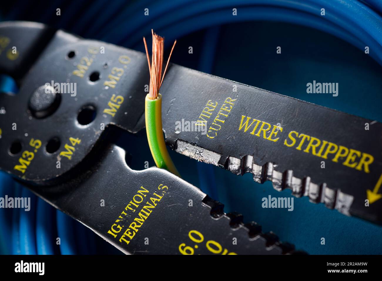 Close-up of a stripped ground wire by a wire stripper Stock Photo - Alamy