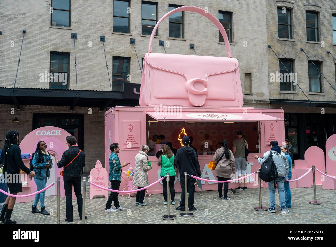 Visitors participate in the Coach brand activation in Gansevoort Plaza ...