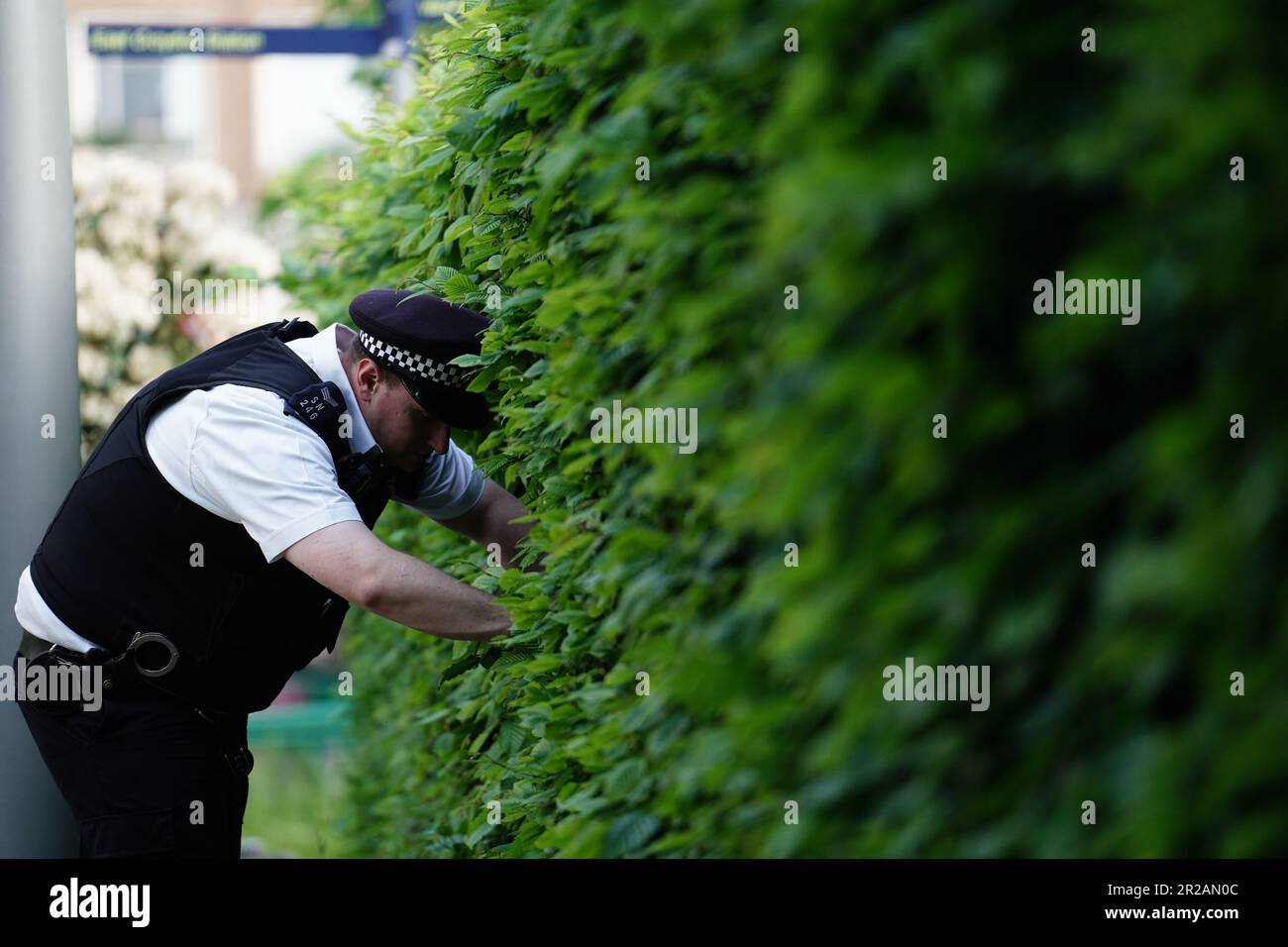 Police officers performing a weapons sweep as part of operational ...