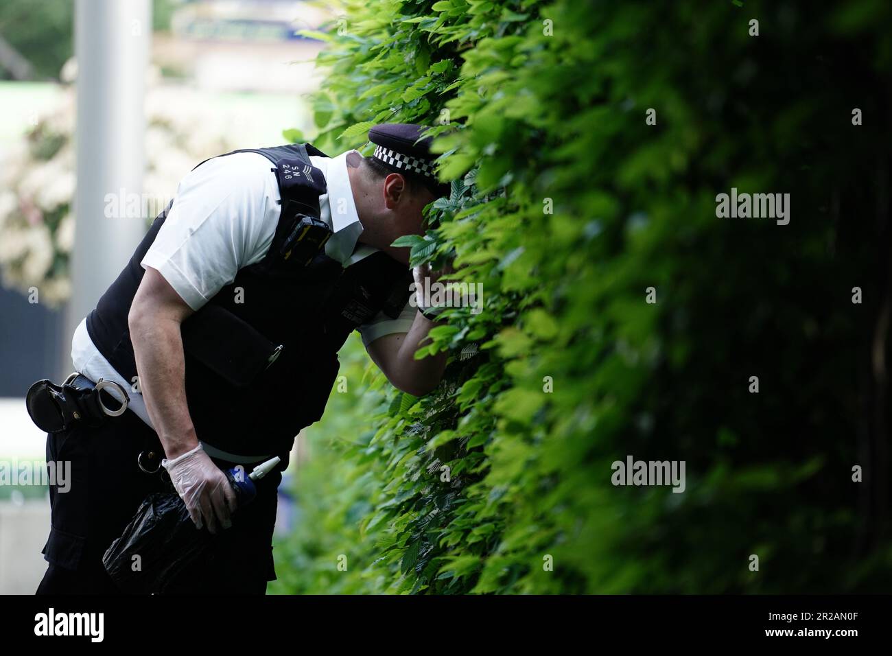 Police officers performing a weapons sweep as part of operational ...