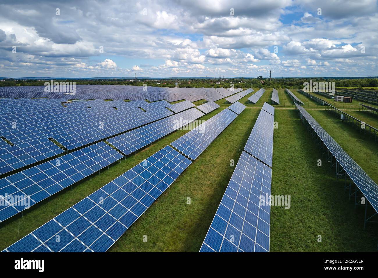 Aerial view of big sustainable electric power plant with many rows of ...
