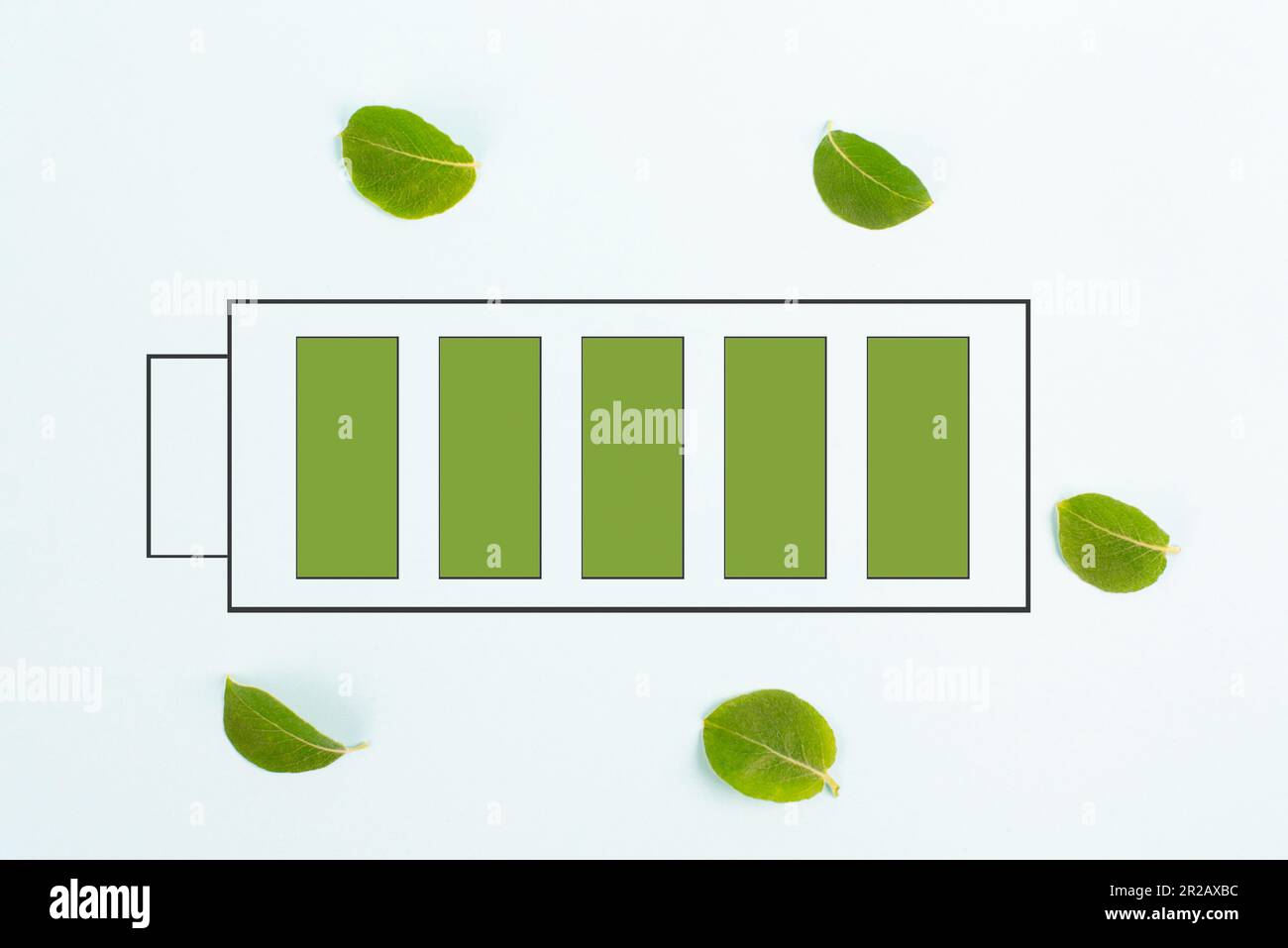 Green energy battery with leaves, sustainable renewable electricity ...