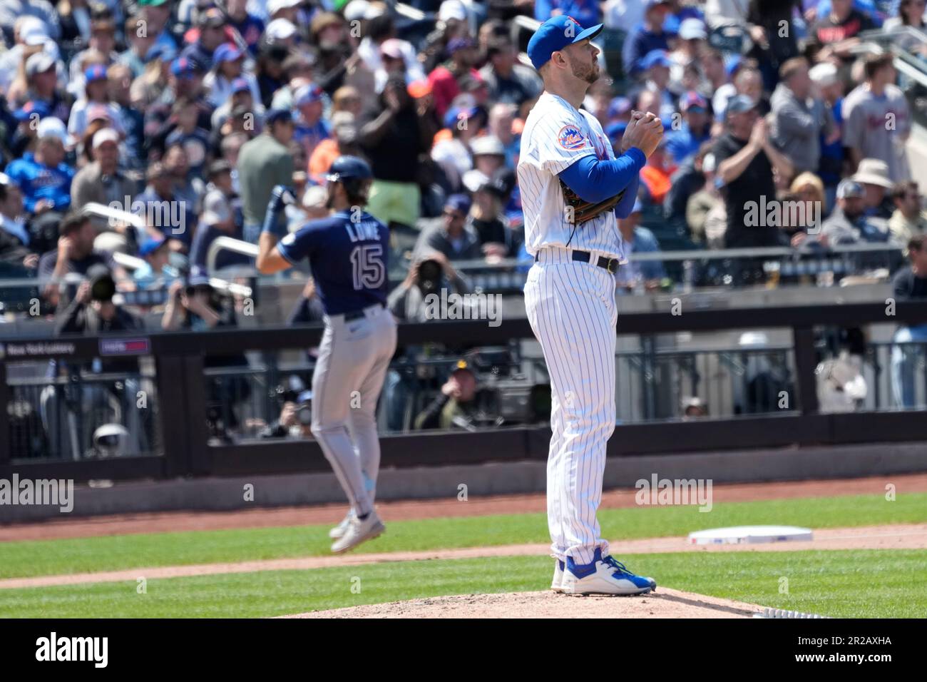 New York Mets pitcher Tylor Megill, right, reacts as Tampa Bay Rays ...