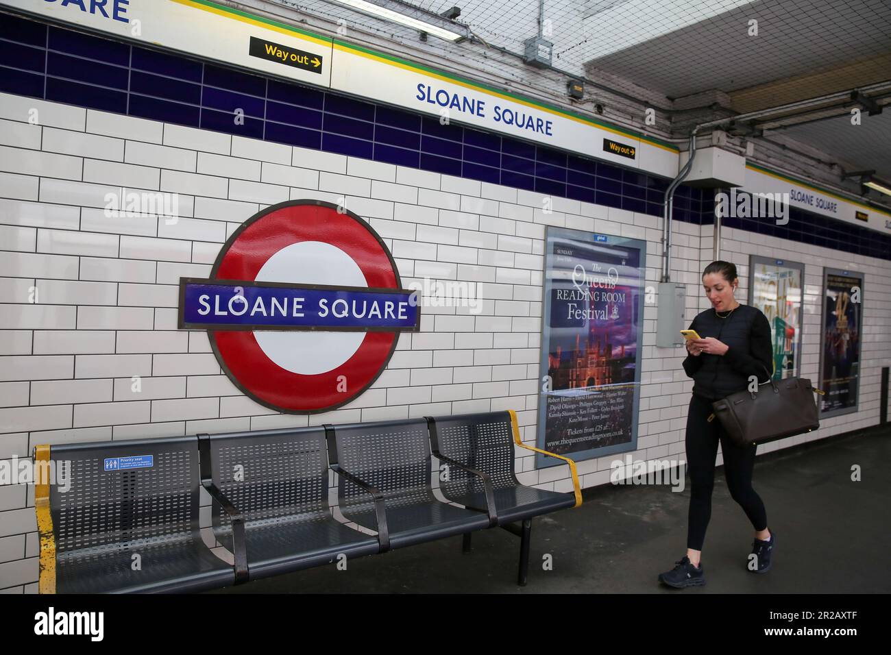 London, UK. 18th May, 2023. A woman walks past Sloane Square sign ...