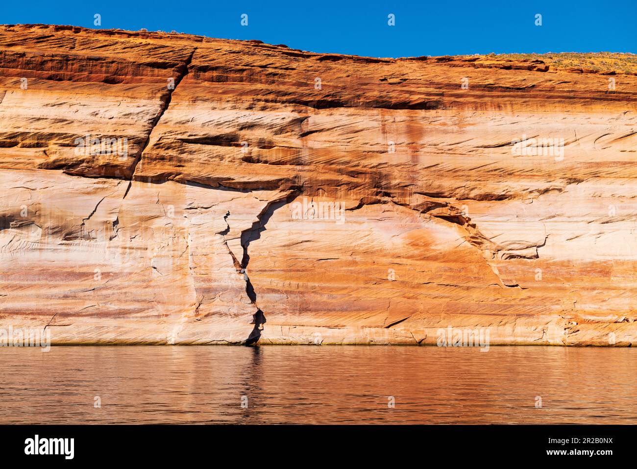 Beautiful sandstone rock formations rise from Lake Powell; Glen Canyon ...