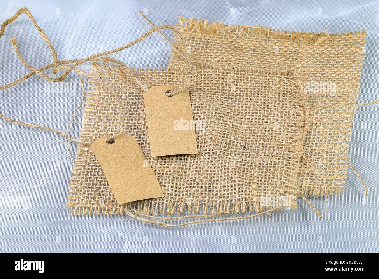 Blank tag tied with natural material string. Price tag, gift tag, sale ...