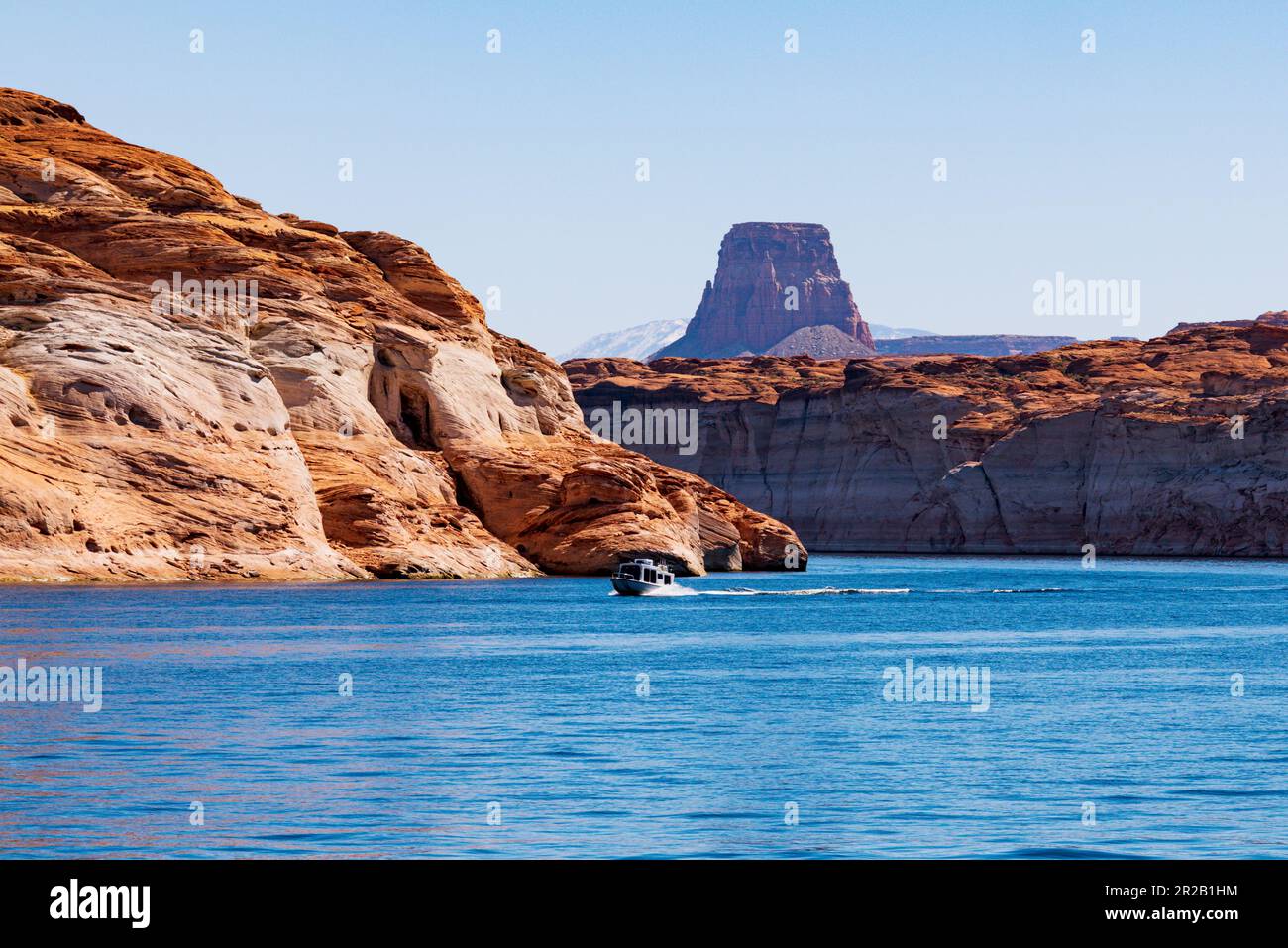 Vacationers in power boat explore Lake Powell; Tower Butte beyond; Glen ...