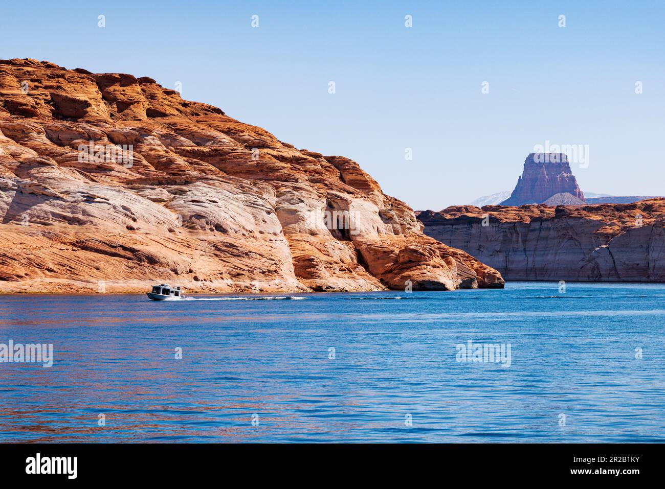 Vacationers in power boat explore Lake Powell; Tower Butte beyond; Glen ...
