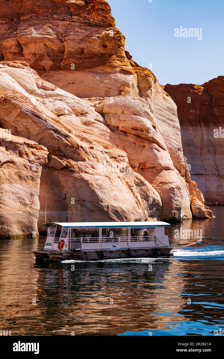 Vacationers in power boat explore Lake Powell; Glen Canyon Dam; Glen ...