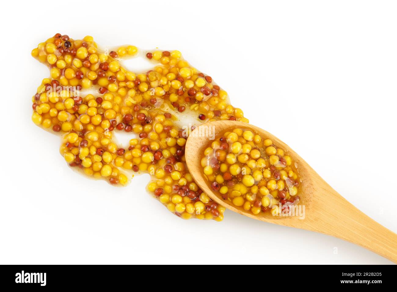 french mustard in wooden spoon isolated on white background with full ...