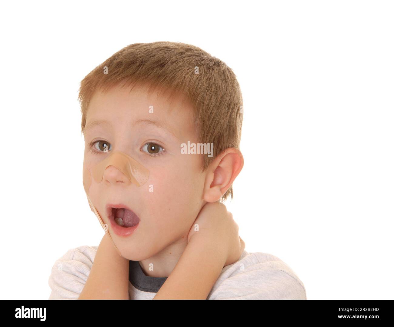 Young boy with an injury covered by a band-aid Stock Photo - Alamy
