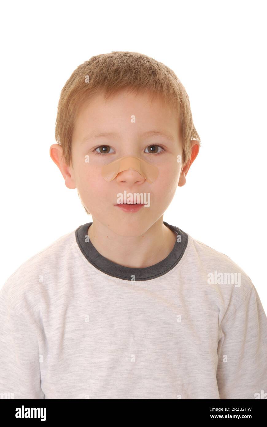 Young boy with an injury covered by a band-aid Stock Photo - Alamy