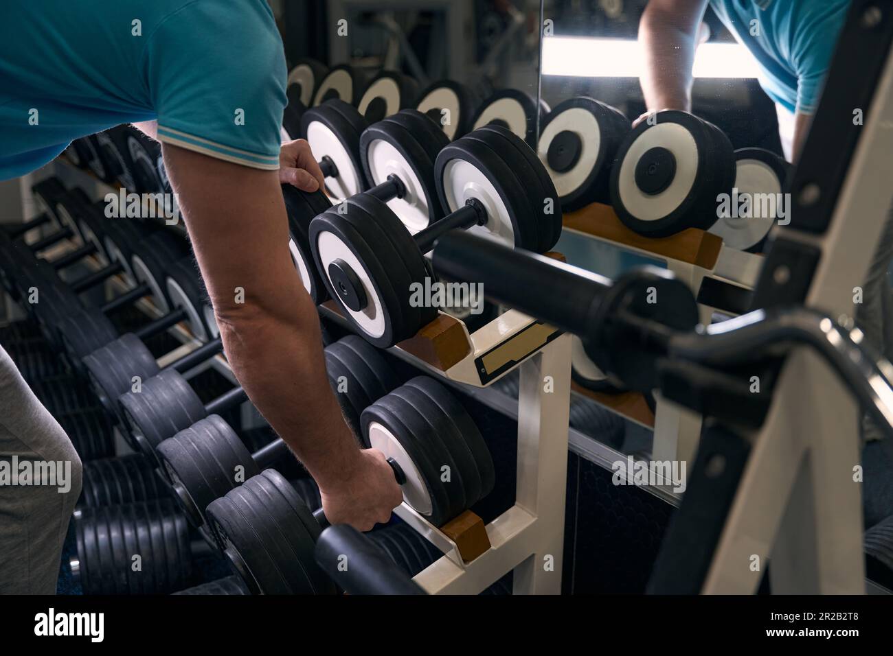 Male athlete preparing for strength workout at gym Stock Photo - Alamy