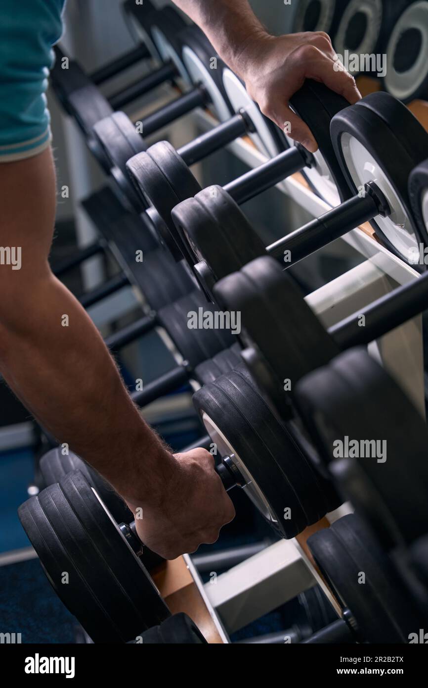 Bodybuilder preparing for strength training at gym Stock Photo - Alamy