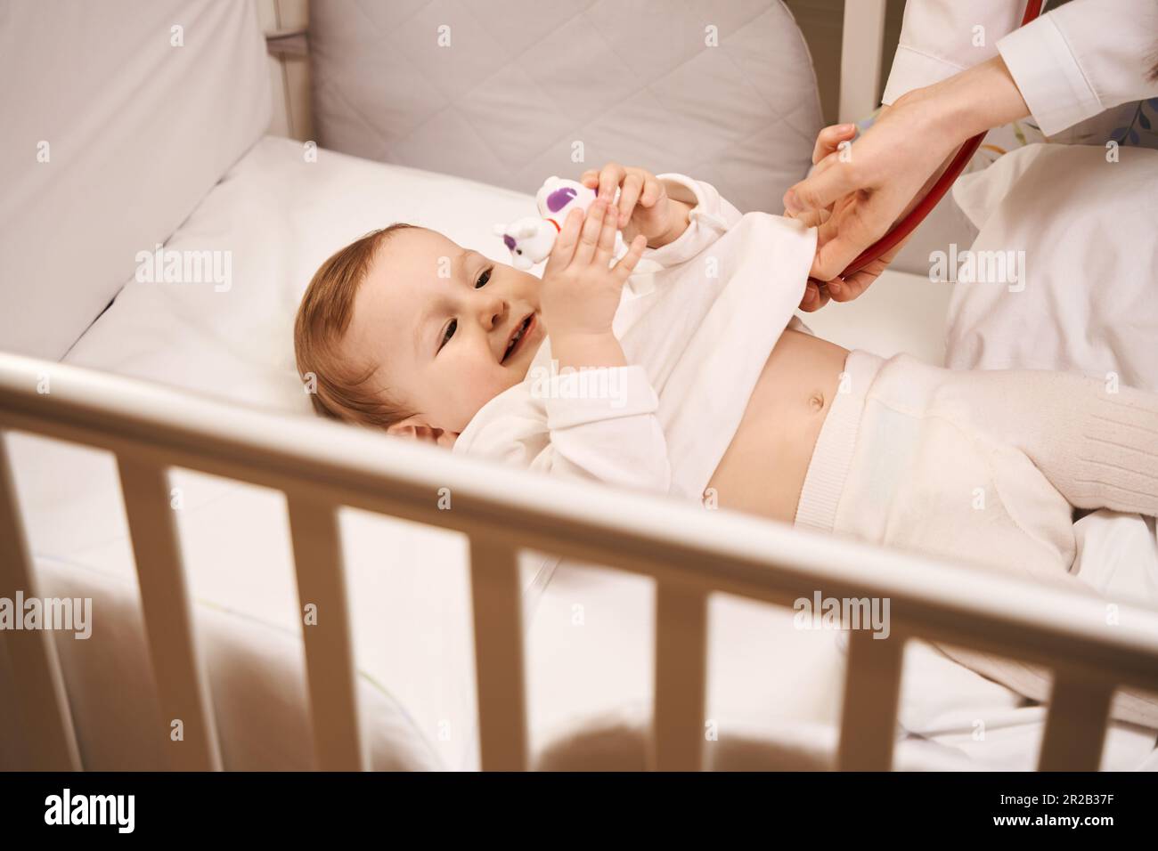 Pleased child being auscultated with experienced pediatrician Stock ...