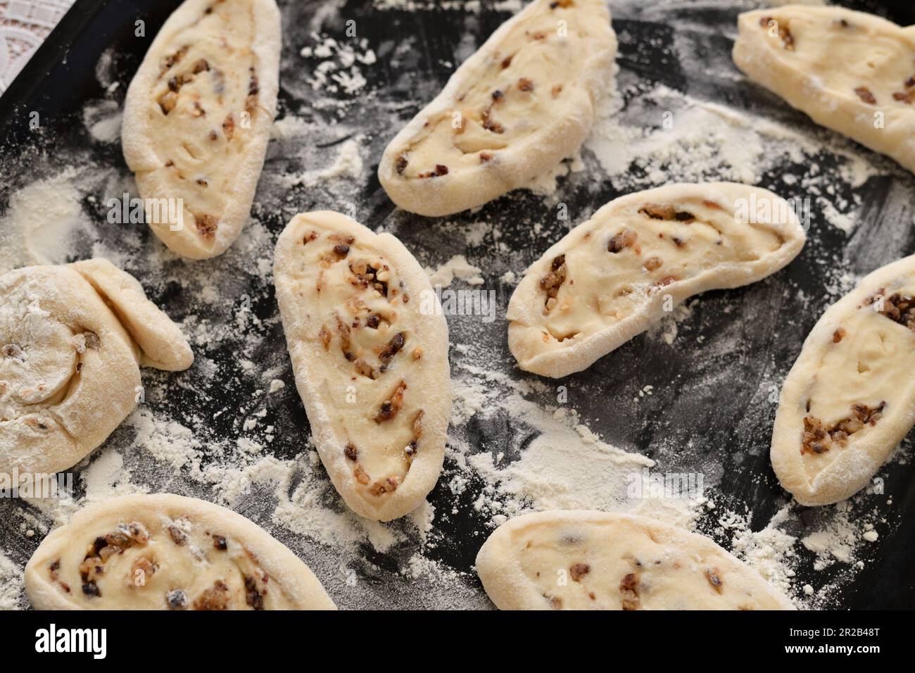 Sweet rolls of biscuit dough uncooked Stock Photo - Alamy