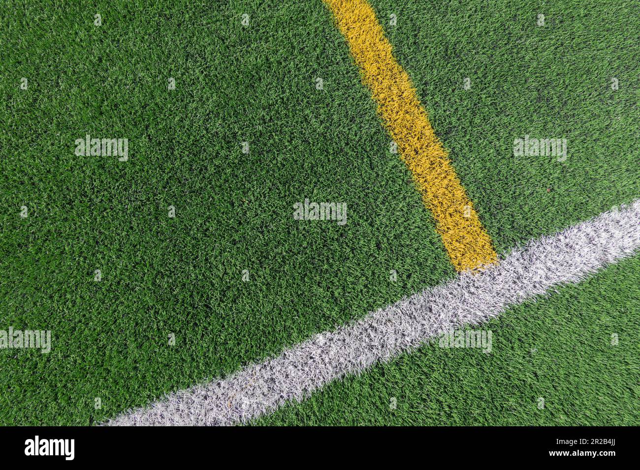 Green artificial grass turf soccer football field background with white ...