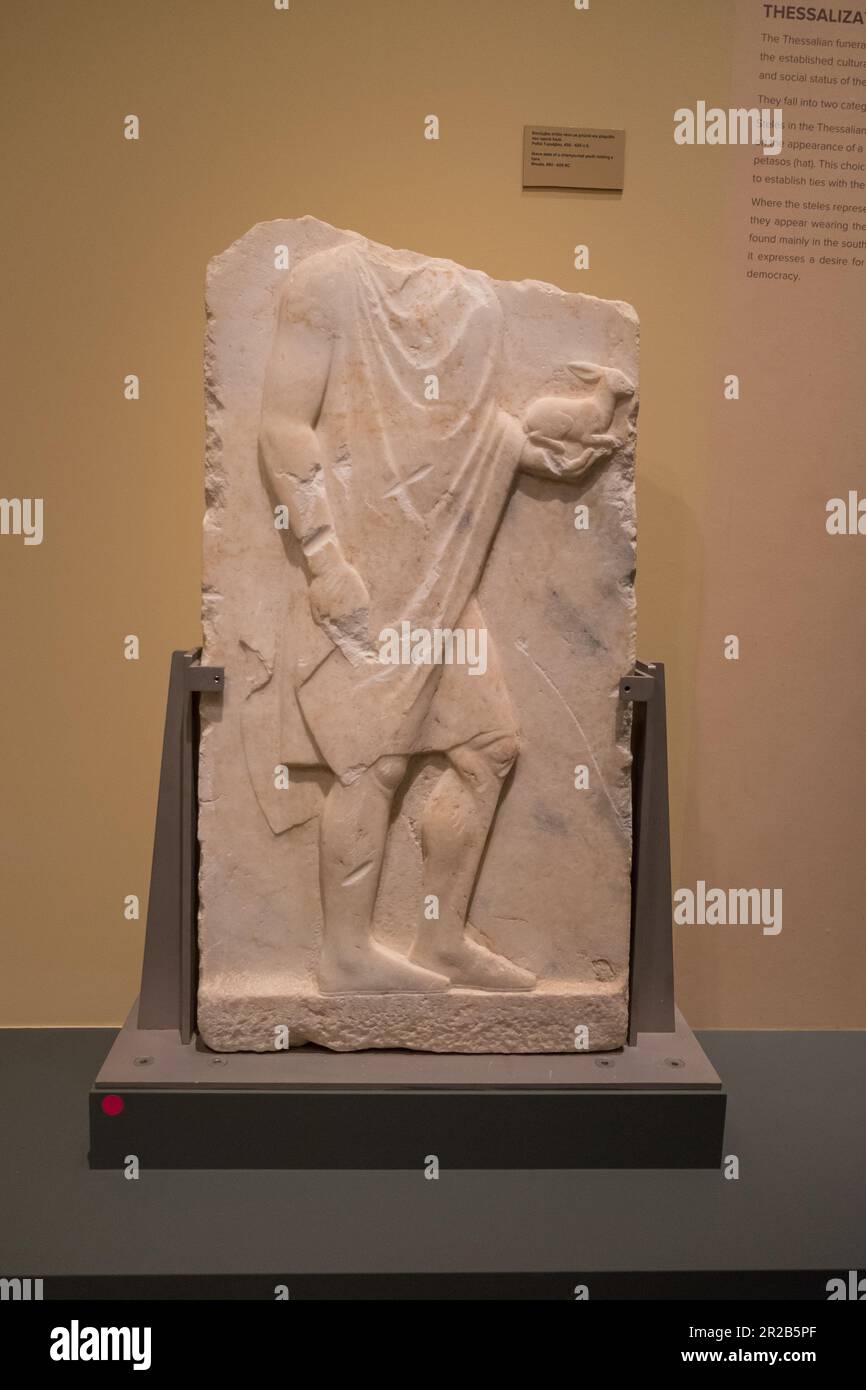 Grave stele of a chlamys-clad youth holding a hare ,(450-425 BC ...