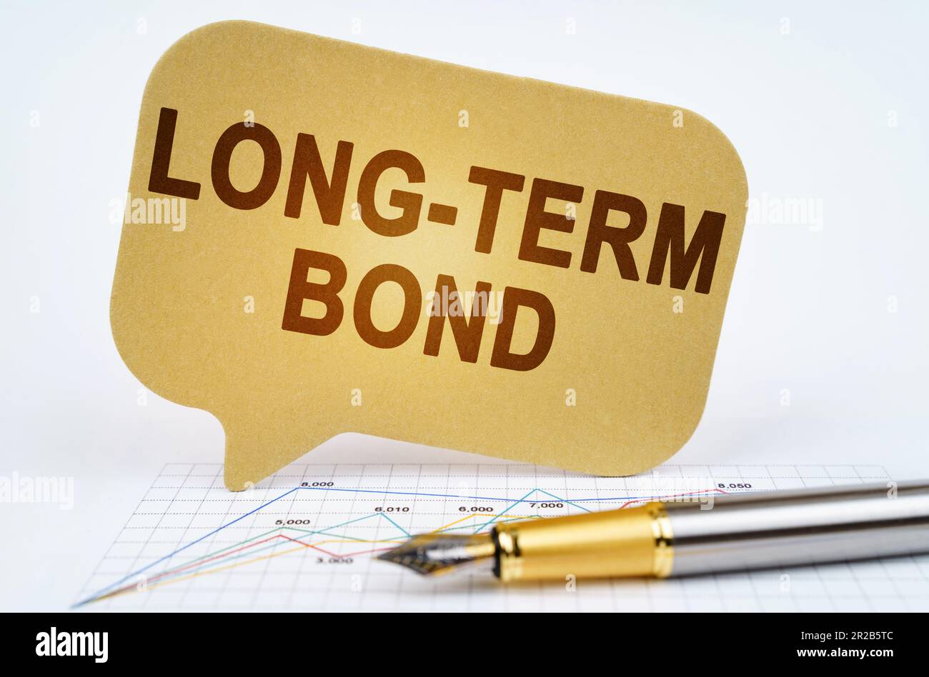 Business concept. On the business diagram is a pen and a sign with the ...