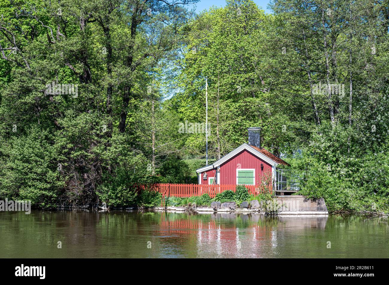 View acrooss Motala river from waterfront park Åbackarna towards ...