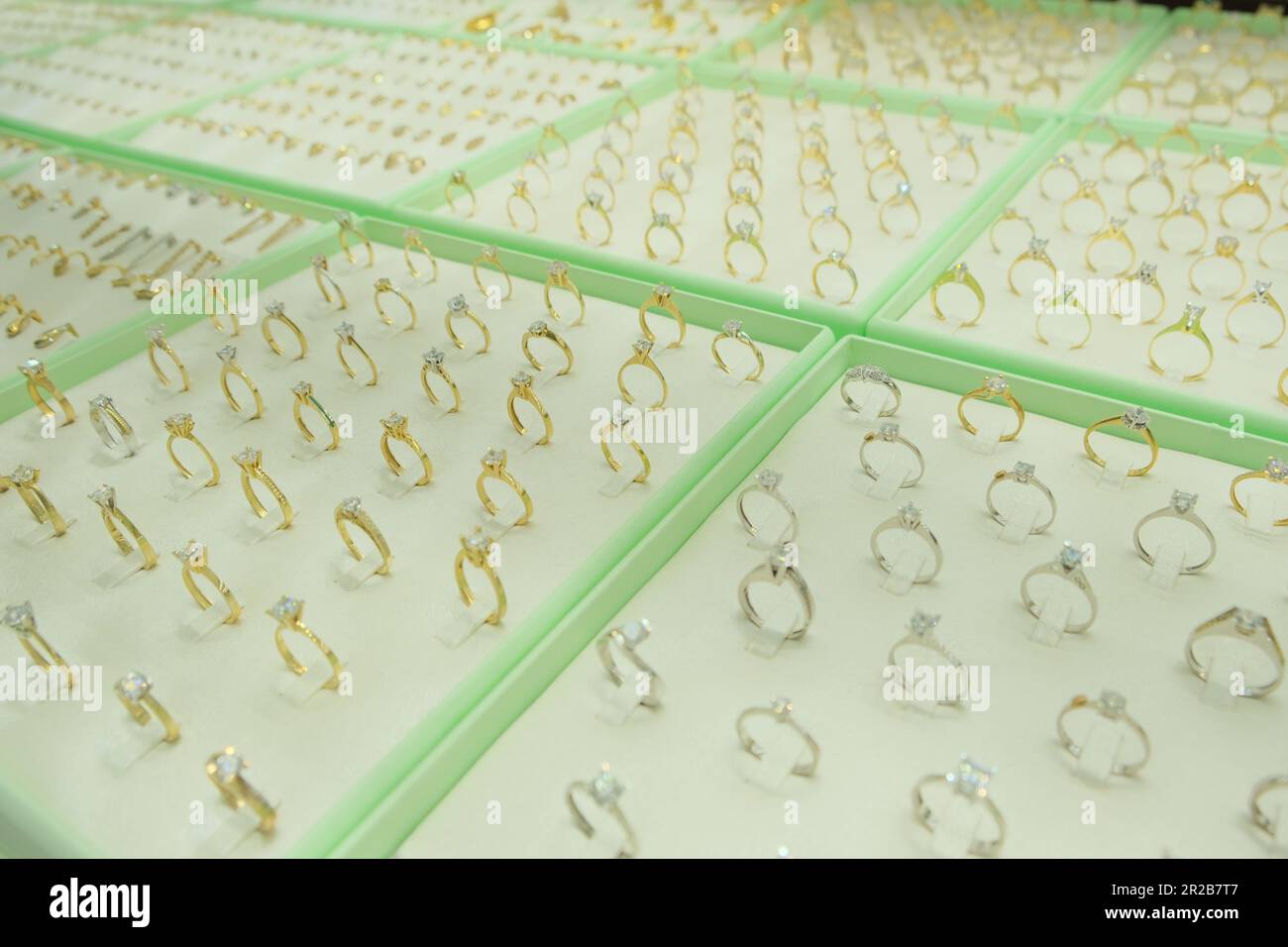 Gold diamond engagement rings show in retail store window display ...
