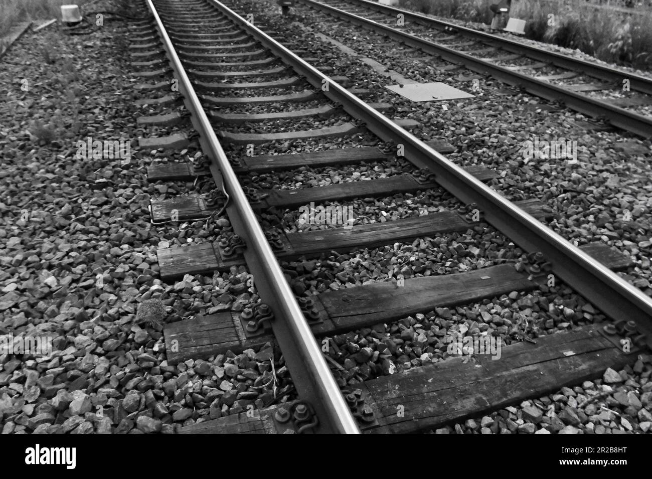 A pair of railroad tracks stretching into the distance, symbolizing journeys, connections, and ...