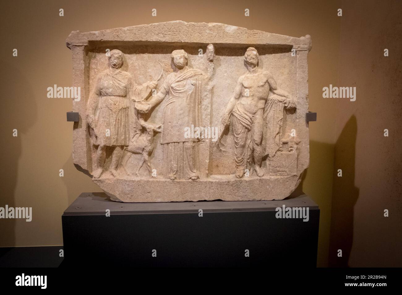 Votive stele of Antigona, daughter of Xenarchos, dedicated to Apollo ...
