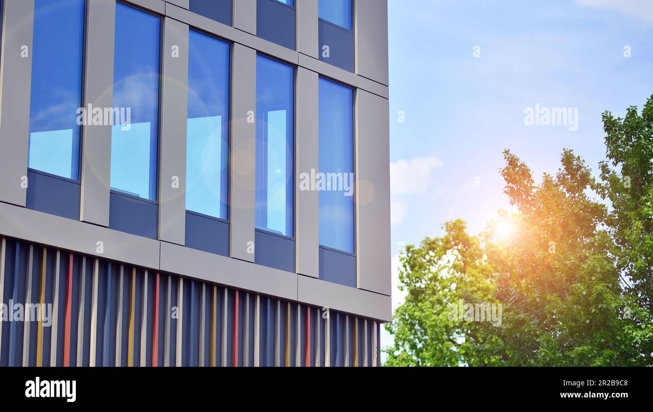 Reflection of modern commercial building on glass with sunlight. Eco ...