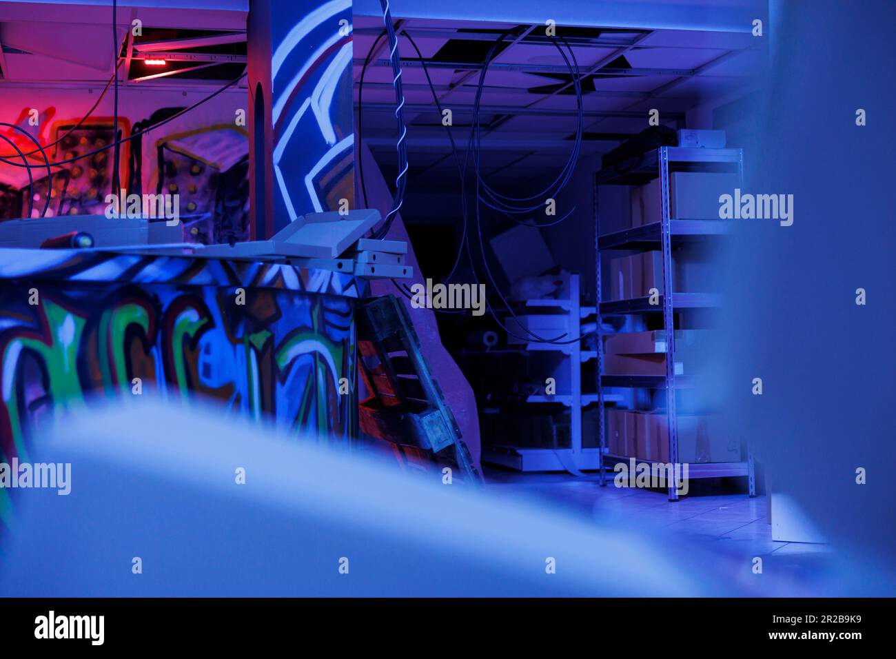 Artistic drawings glowing under bright neon lights Stock Photo - Alamy