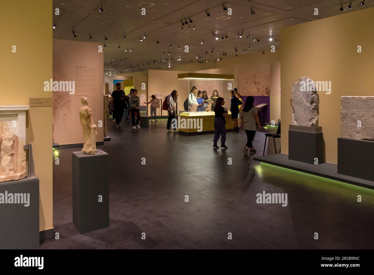 Visitors walking and staring the exhibits from the classical antiquity ...