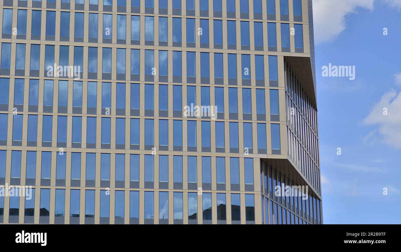 Abstract closeup of the glass-clad facade of a modern building covered ...
