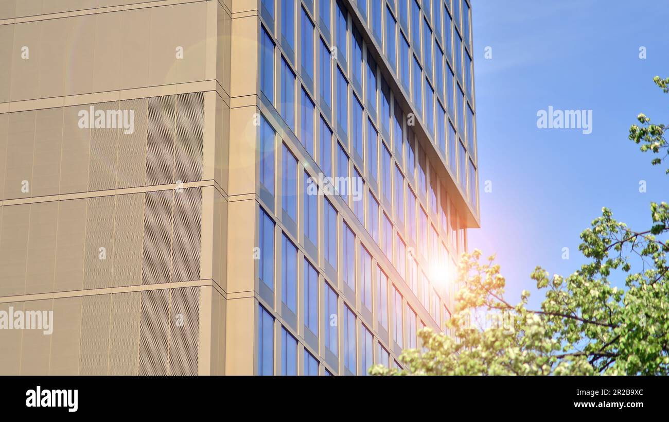 Reflection of modern commercial building on glass with sunlight. Eco ...