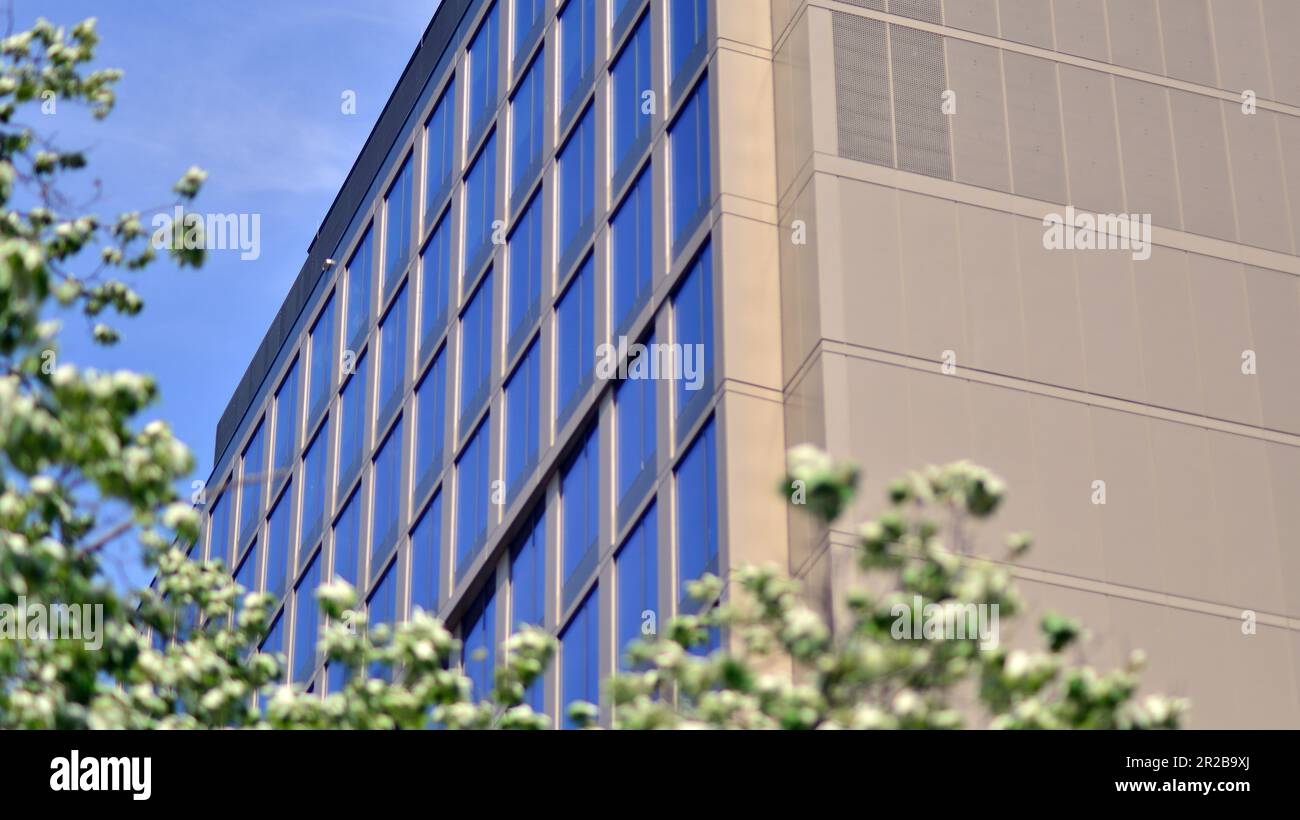 Reflection of modern commercial building on glass with sunlight. Eco ...