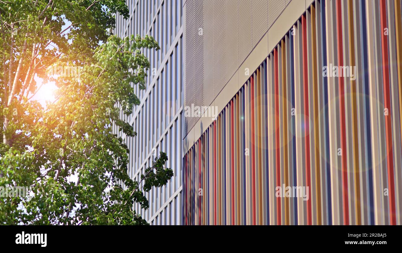 Reflection of modern commercial building on glass with sunlight. Eco ...