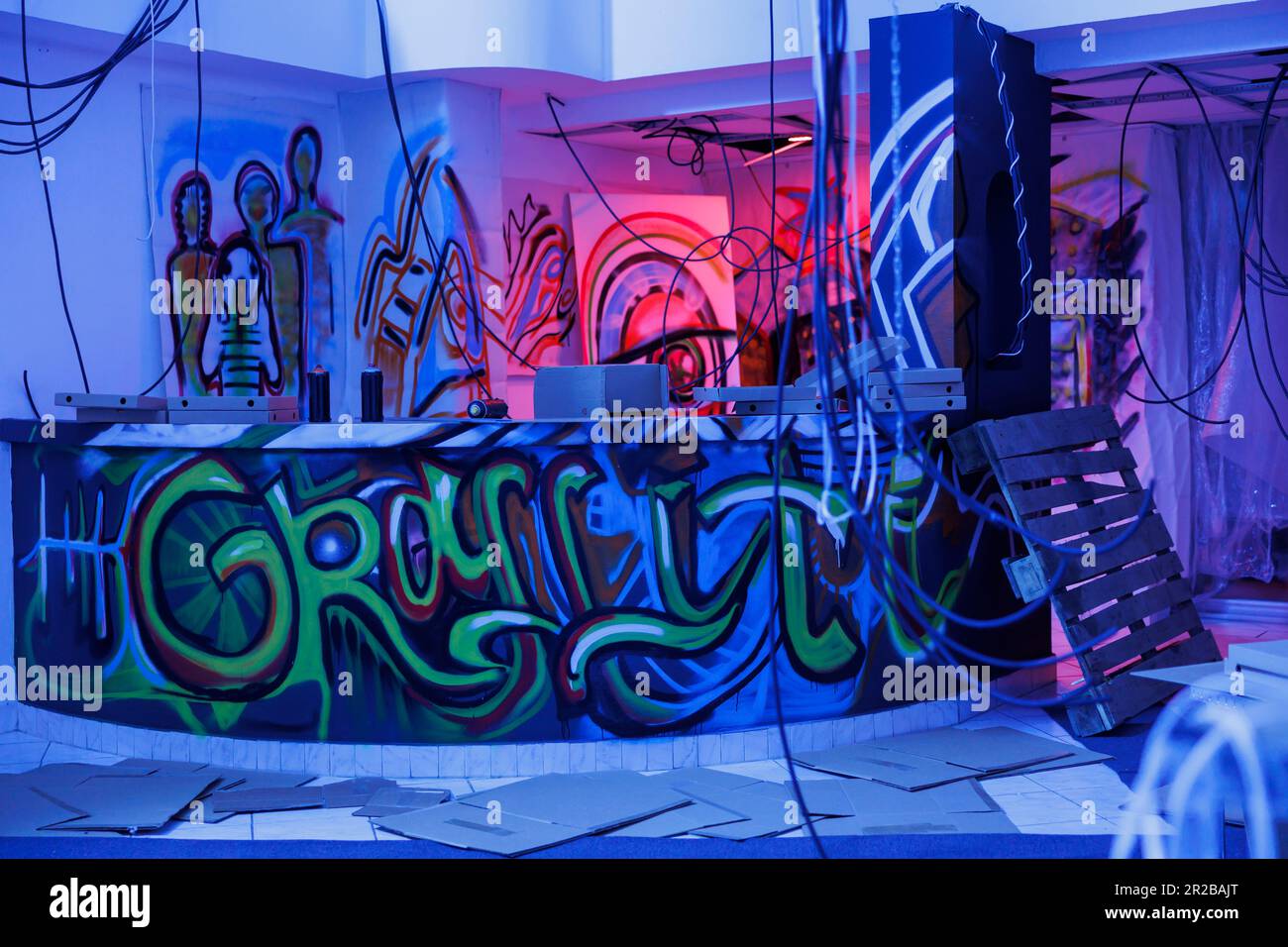 Graffiti art on rusty walls glowing with bright neon lights Stock Photo ...