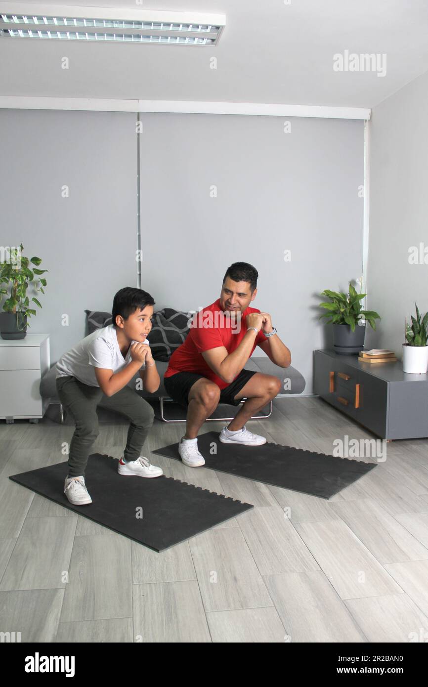 Boxing classes in the living room of his house between dad and son as a ...