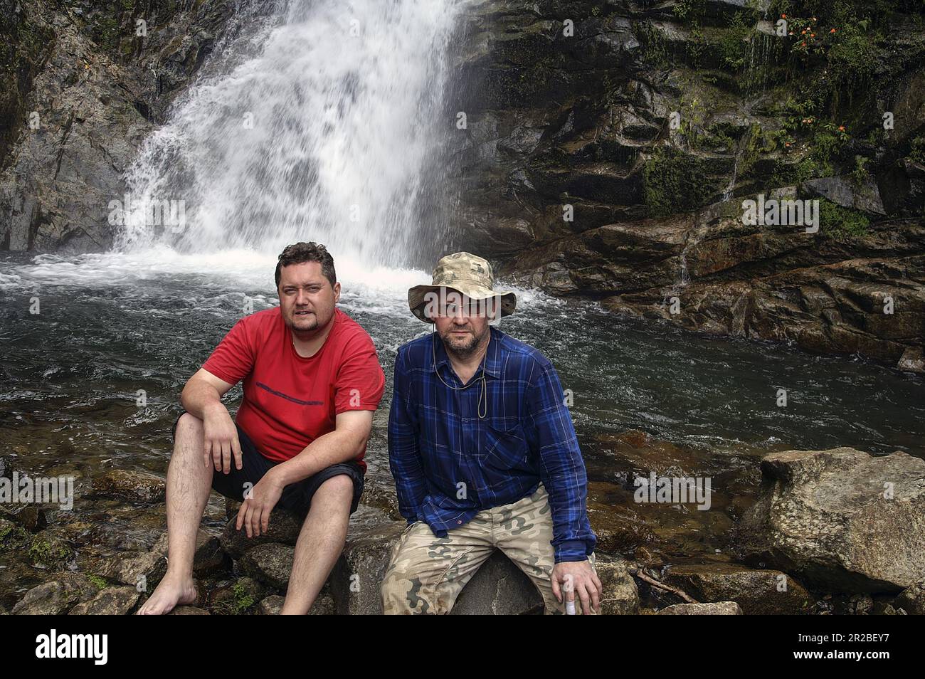 PNG Papua New Guinea Eastern Highlands Goroka; tourists at a waterfall ...