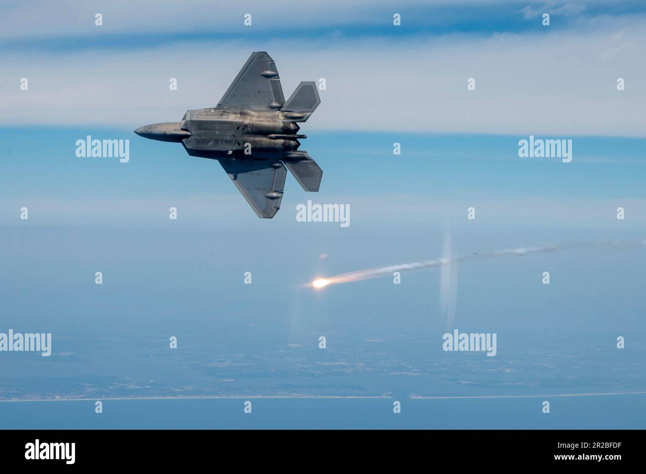 A U.S. Air Force F-22 Raptor assigned to the 43d Fighter Squadron drops ...