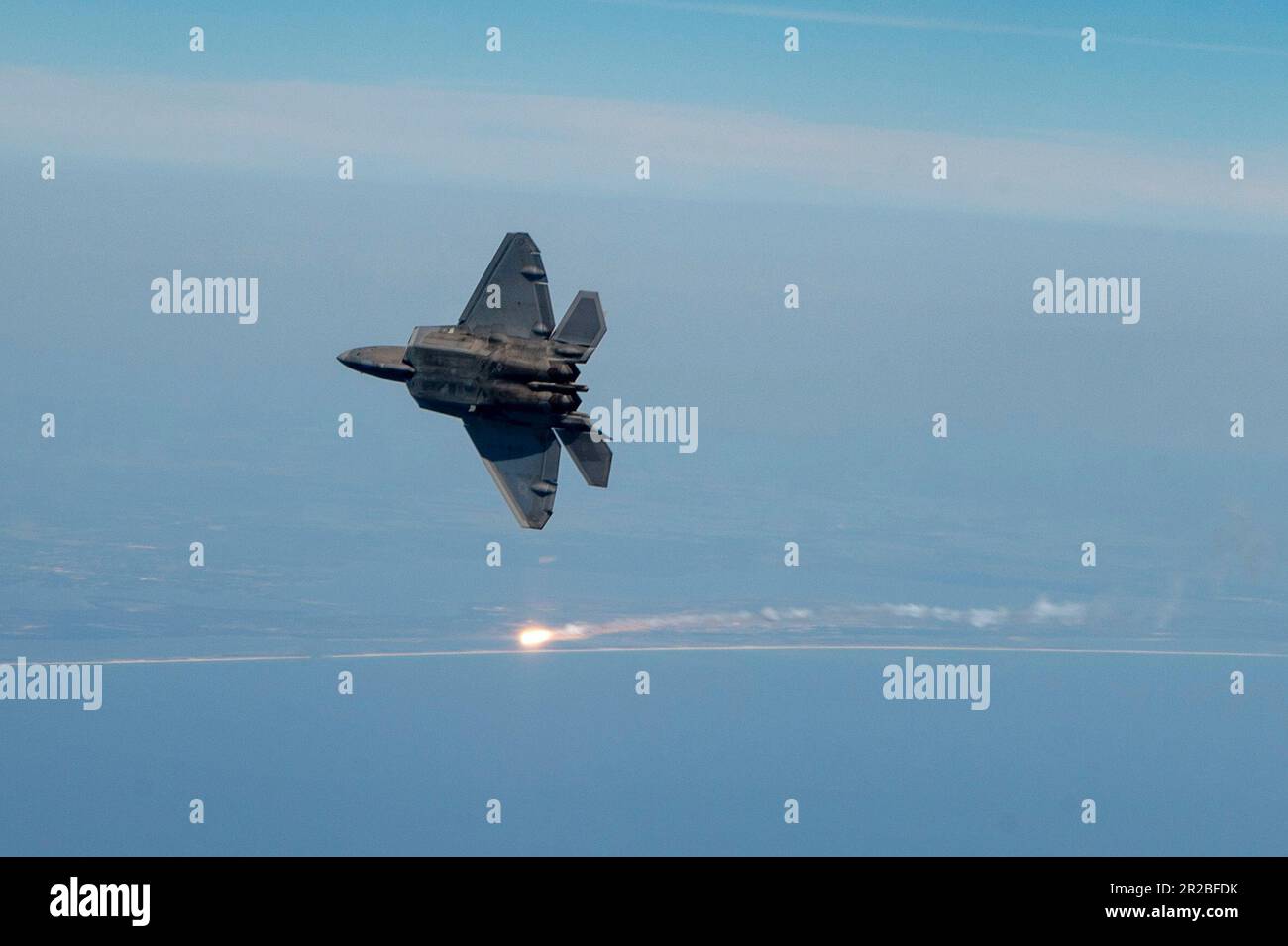 A U.S. Air Force F-22 Raptor assigned to the 43d Fighter Squadron drops ...