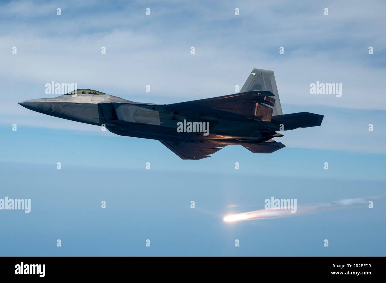 A U.S. Air Force F-22 Raptor assigned to the 43d Fighter Squadron drops ...