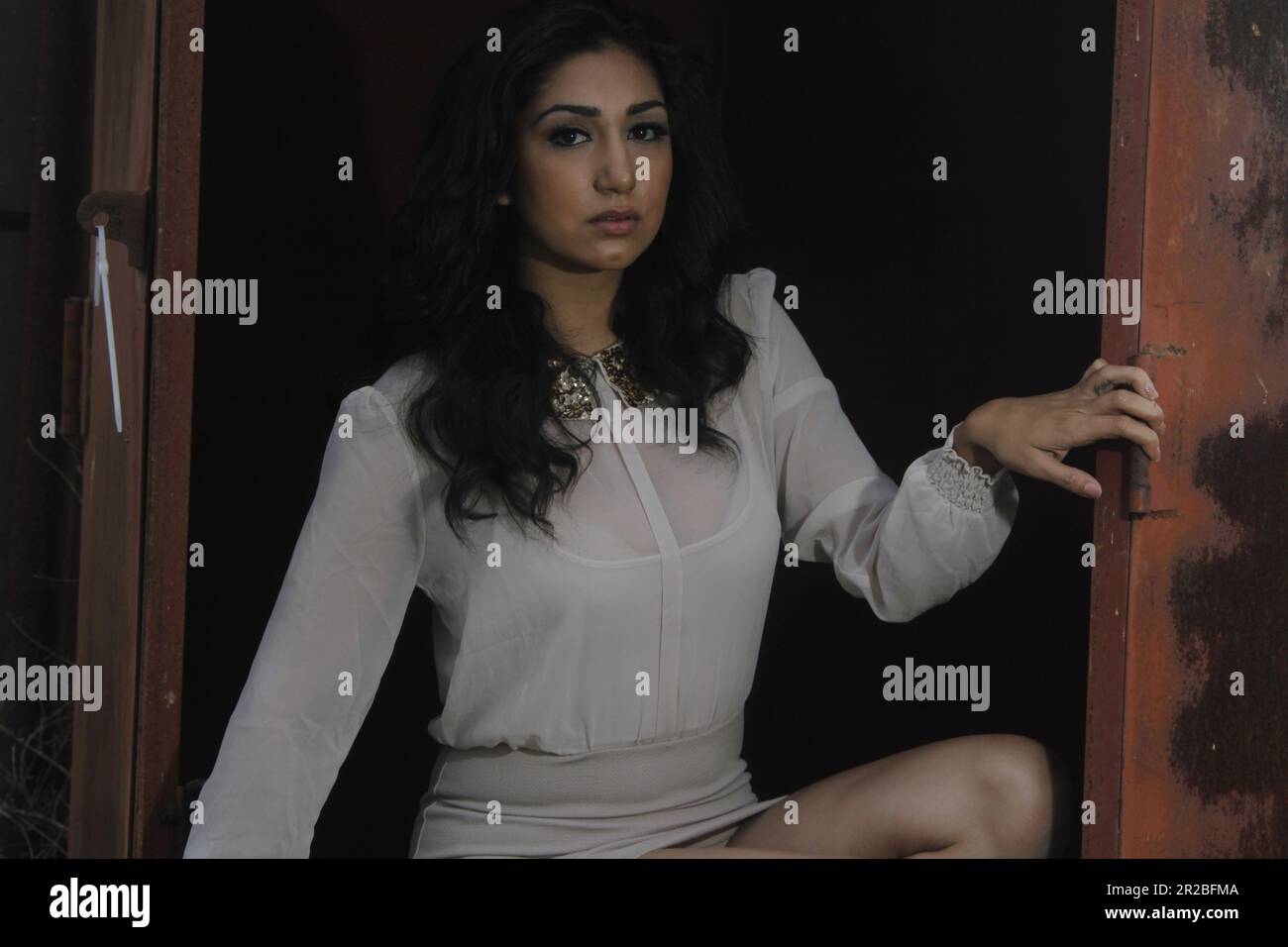 Photo of pretty Mexican lady in a park Stock Photo - Alamy