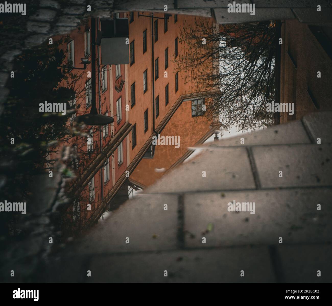 Puddle on alley street hi-res stock photography and images - Alamy