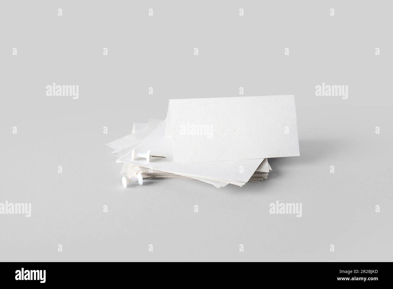 White sticky notes with pins on grey background Stock Photo - Alamy