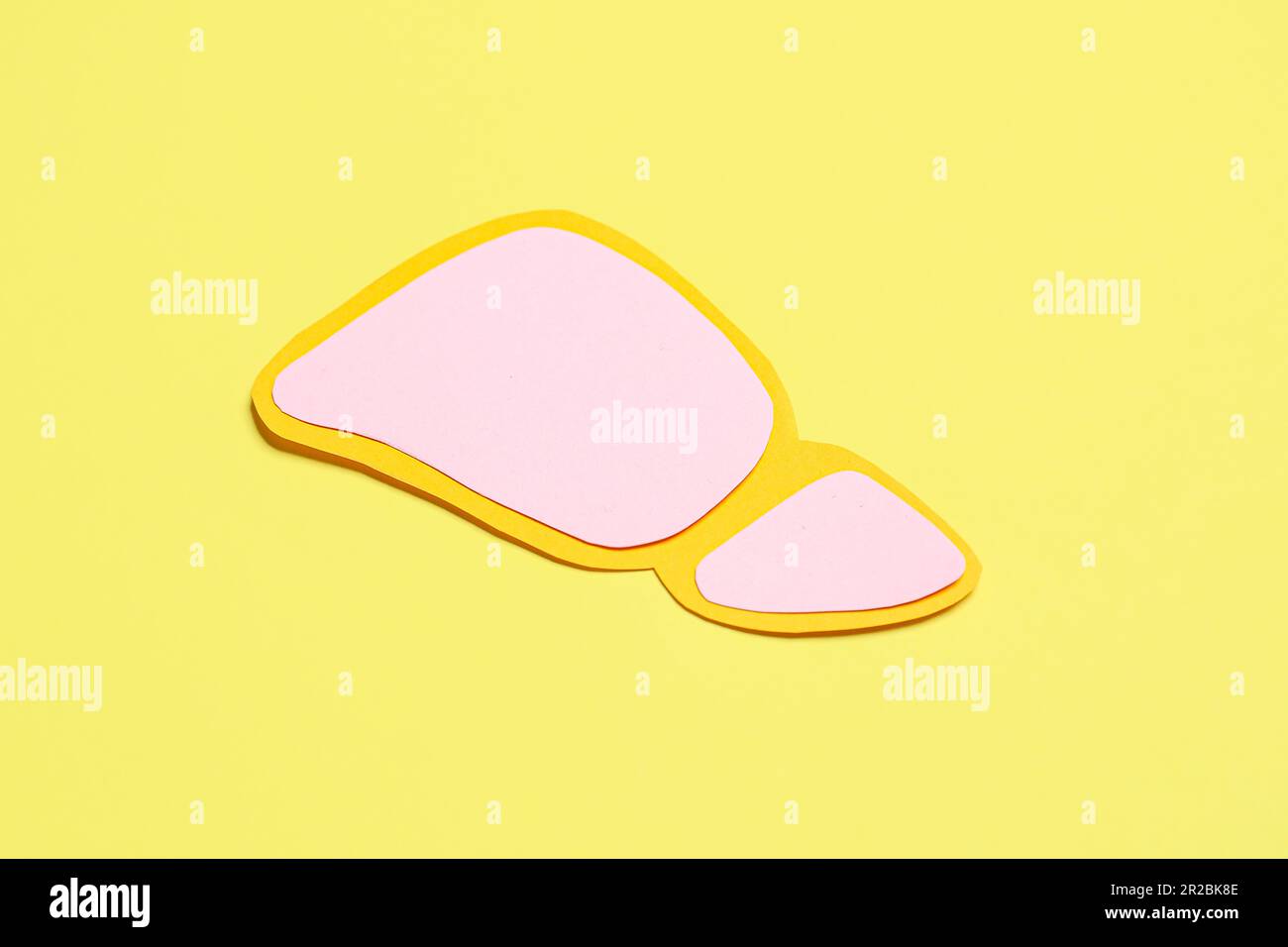 Pink paper liver on yellow background Stock Photo - Alamy