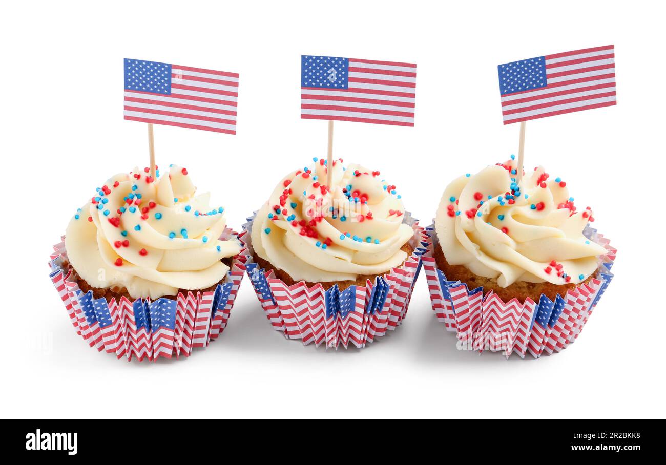 Tasty patriotic cupcakes and flag of USA on white background. American ...