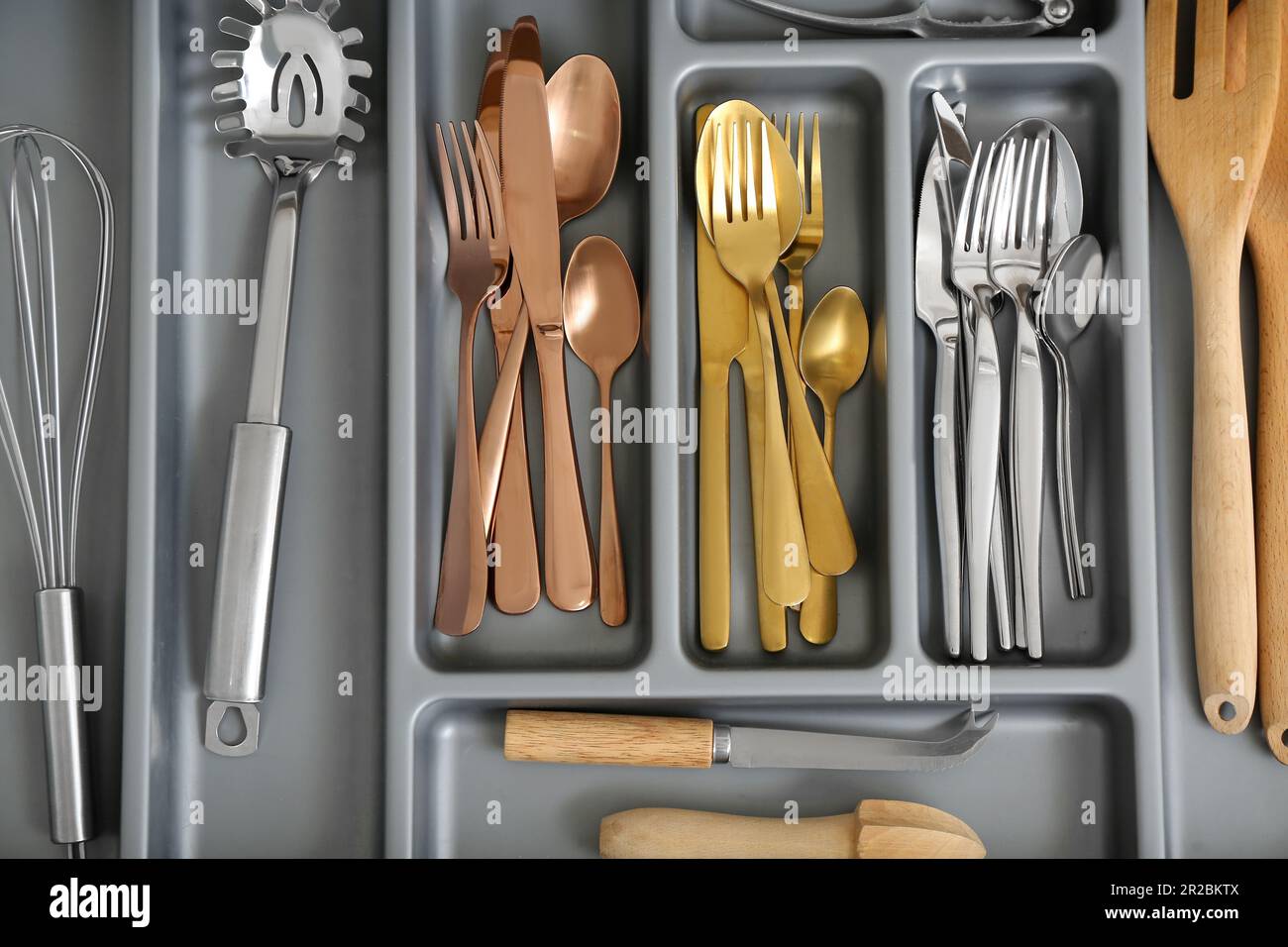 Open kitchen drawer with different cutlery Stock Photo - Alamy