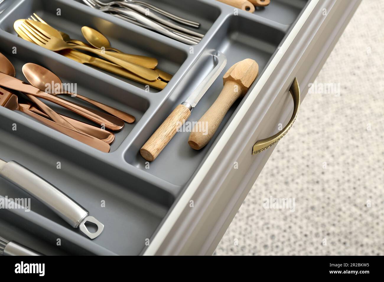 Open kitchen drawer with different cutlery Stock Photo - Alamy